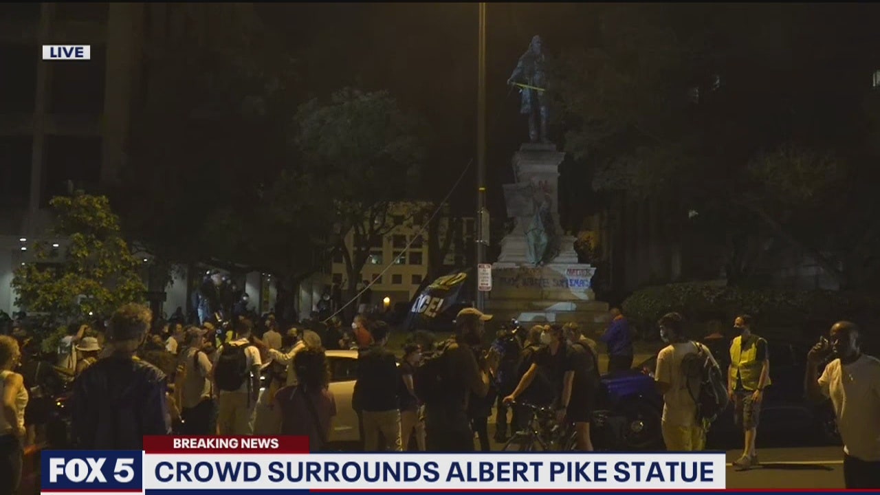 Protesters trying to pull down Albert Pike statue