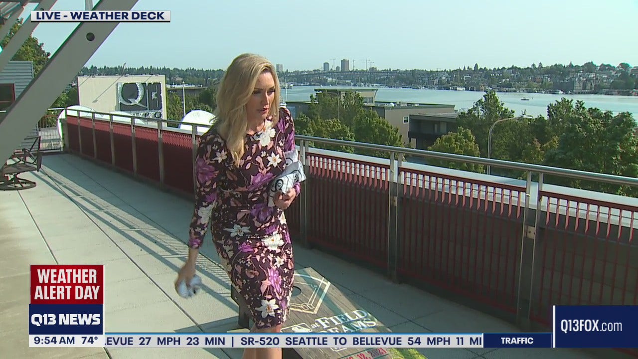 Q13 Fox anchors Liz Dueweke and Travis Mayfield play cornhole | FOX 13 ...