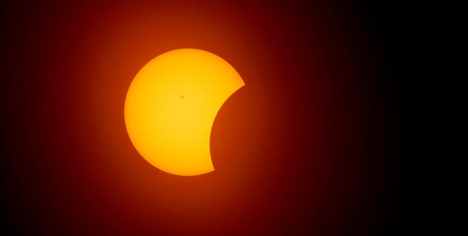 Gray skies, rain squash partial eclipse viewing in Seattle