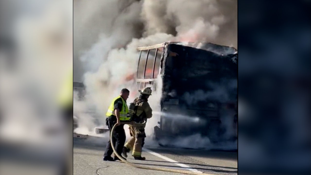 Crews extinguish flaming bus on I-90 | FOX 13 Seattle