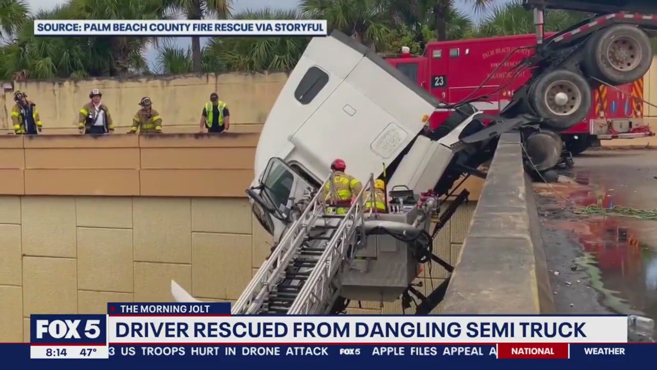 Video shows incredible rescue after driver gets stuck in semi-truck ...