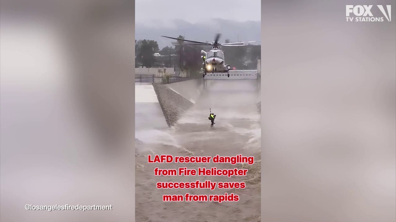 Firefighter dangling from chopper rescues man | FOX 11 Los Angeles