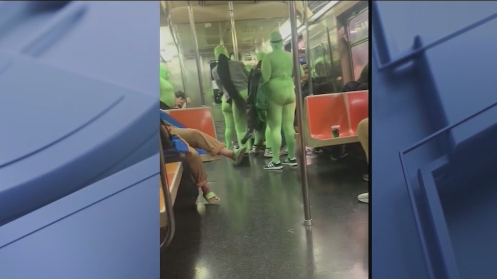 Group of 'aliens' in neon bodysuits assault teens on NYC subway train ...