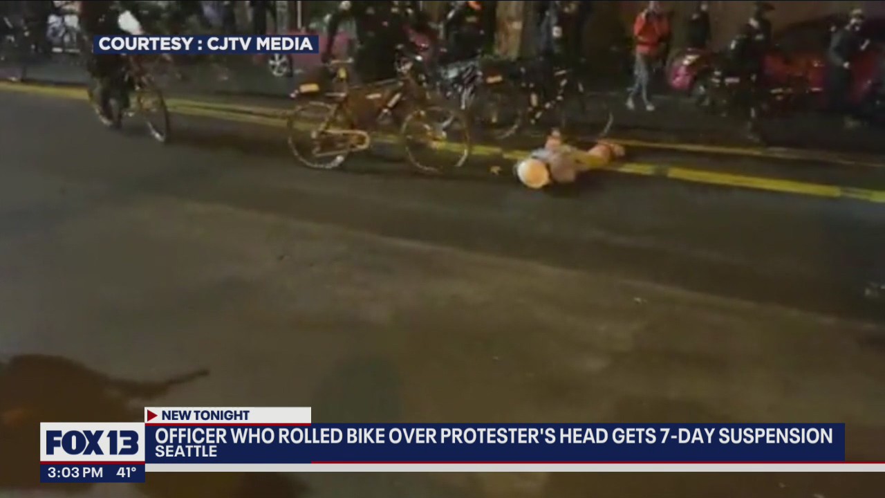 Officer who rolled bike over protester's head gets 7-day suspension ...