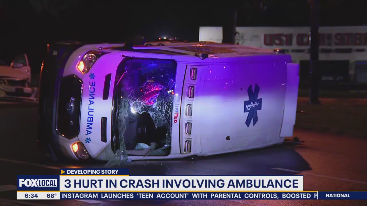 Ambulance flipped onto its side after being struck by car that ran red ...
