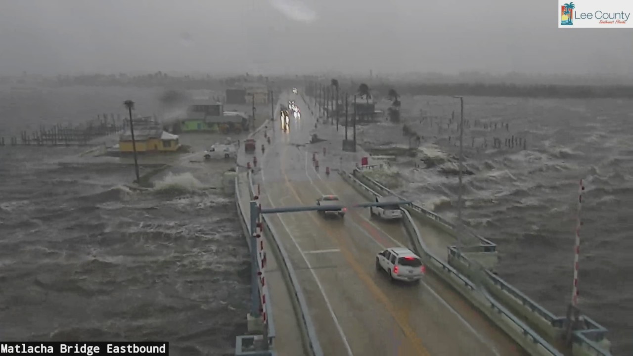 Hurricane Helene: Cars crossing Matlacha Bridge as waves crash onto ...