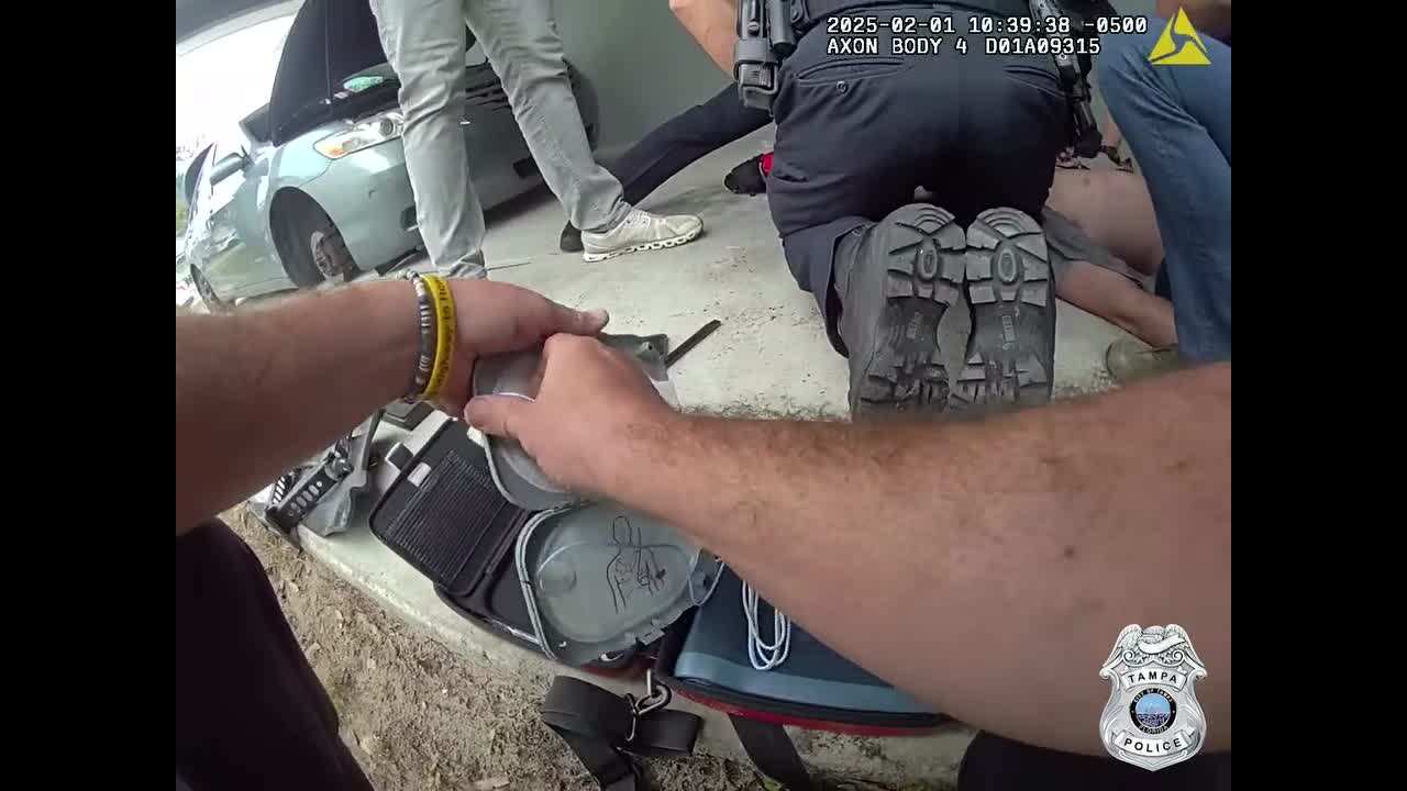 Tampa police save man pinned underneath his car | FOX 13 Tampa Bay