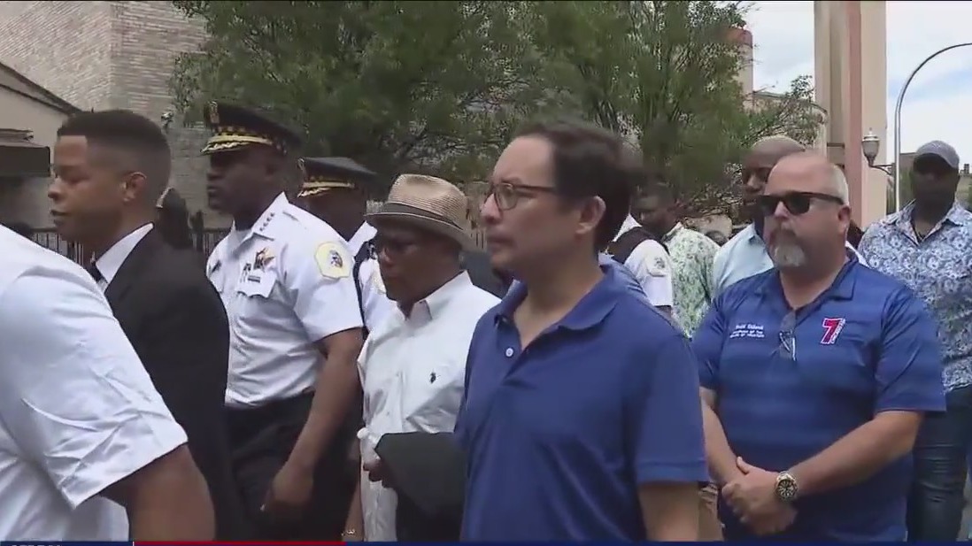 Community mourns slain officer, Rev. Larry Neuman with vigil and march ...