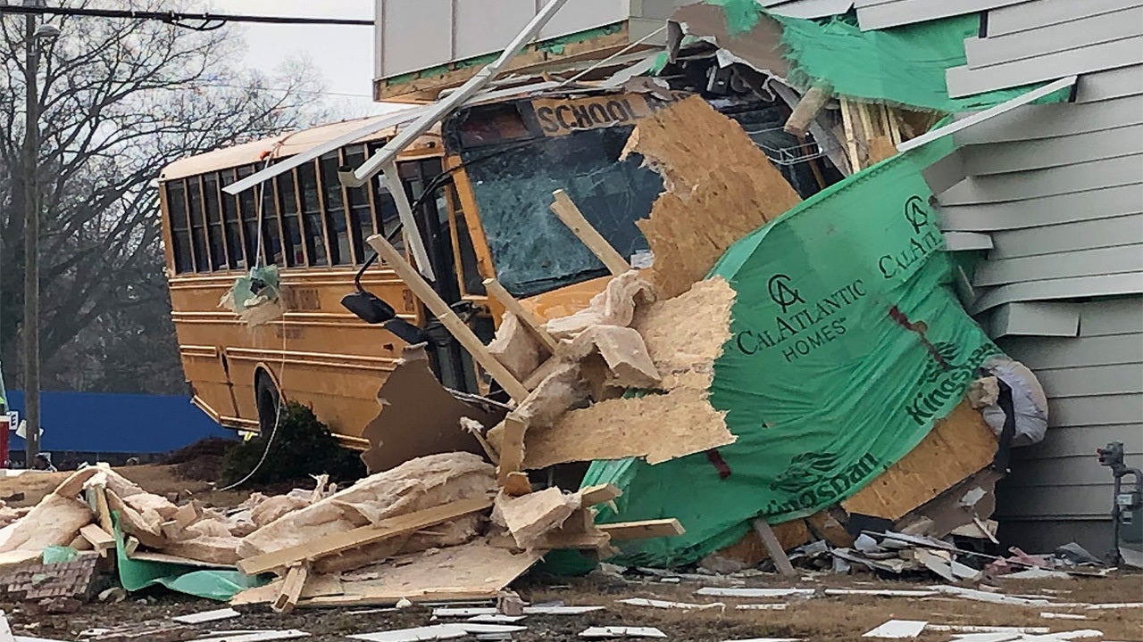 2 hospitalized after CMS school bus crashes into building just outside ...