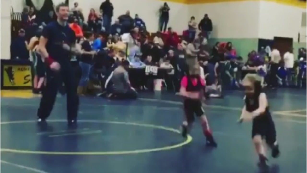 Little boy runs away from opponent in hilarious wrestling match