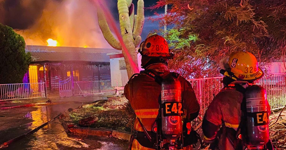 Over 50 firefighters battle house fire in north Phoenix; 2 people ...