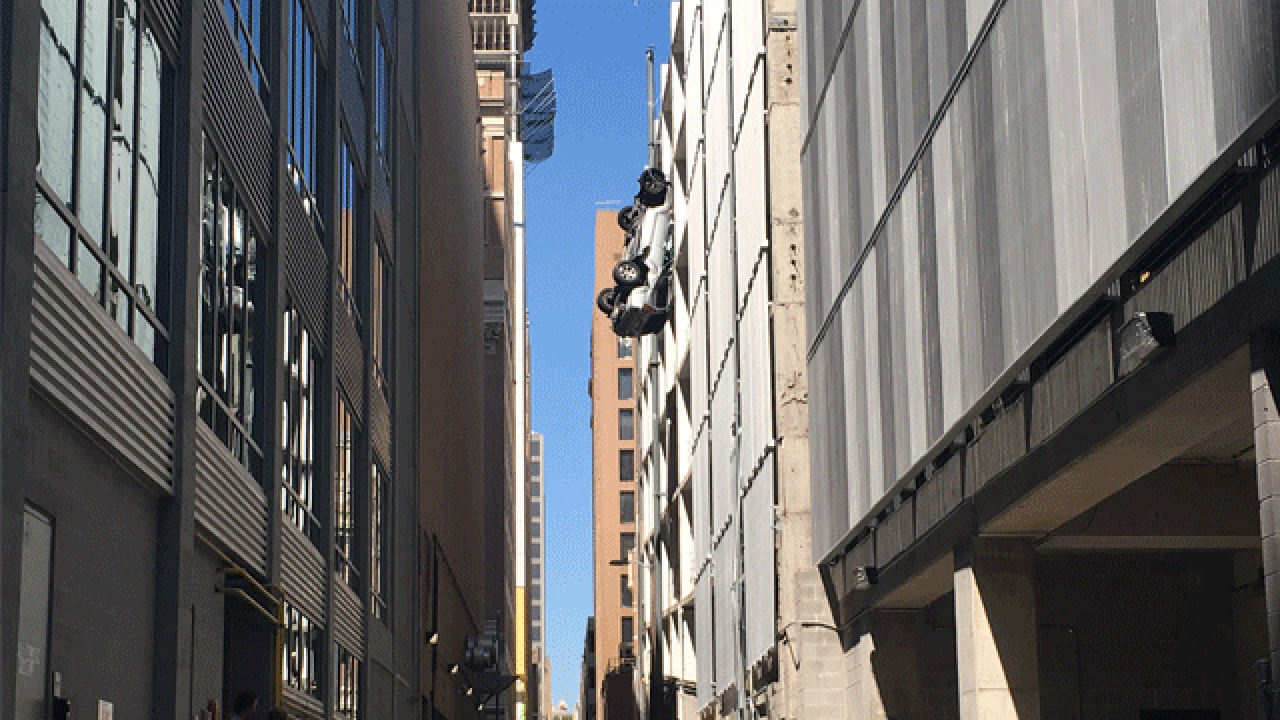 Car dangling from parking garage in downtown Austin | FOX 13 Tampa Bay
