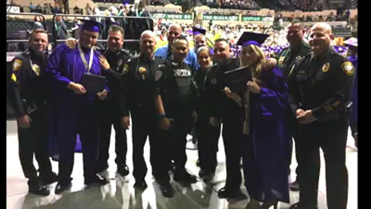 Officers cheer on children of fallen officer at graduation | FOX 13 ...