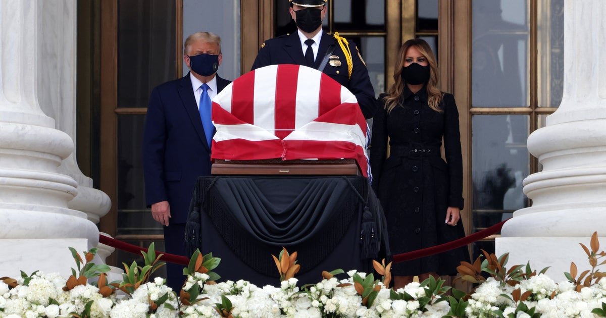 Spectators boo President Trump as he pays respects to Ruth Bader ...