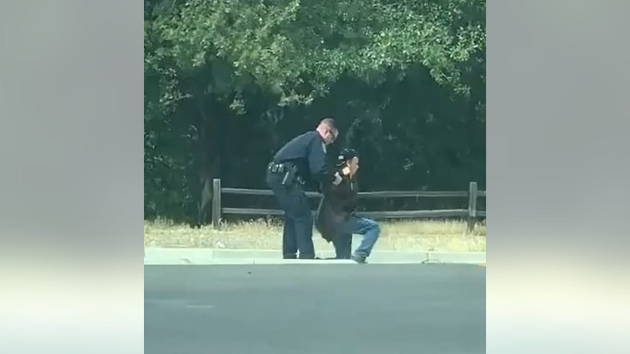 Video captures officer helping blind man after he fell while crossing ... Video captures officer helping blind man after he fell while crossing ...