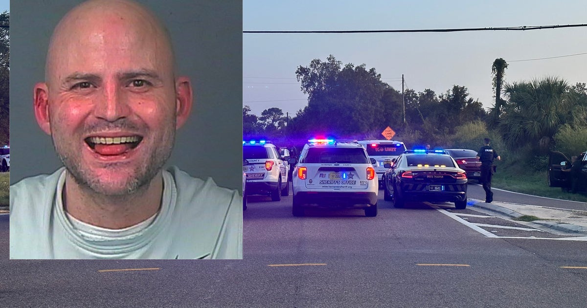 Armed Florida man in tactical vest driving wrong way threatens driver ...