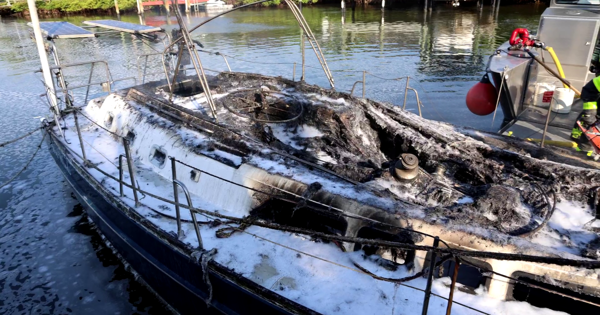 PHOTOS: Fire destroys 45-foot sailboat docked behind Apollo Beach home ...