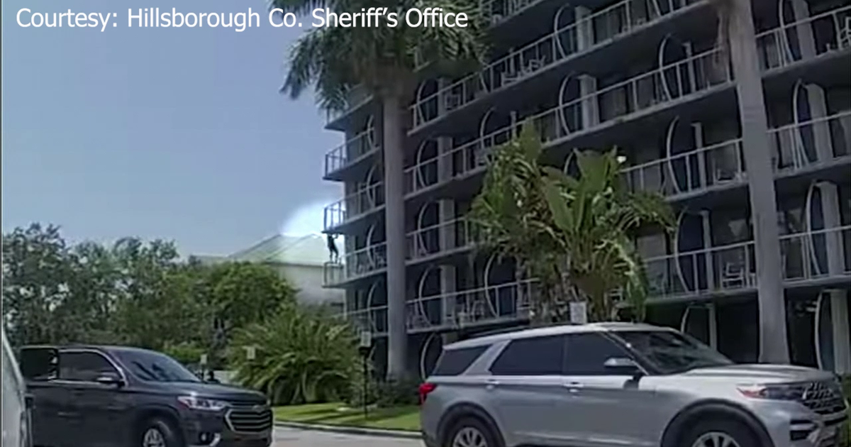 VIDEO: Armed robbery suspect jumps across balconies moments before ...