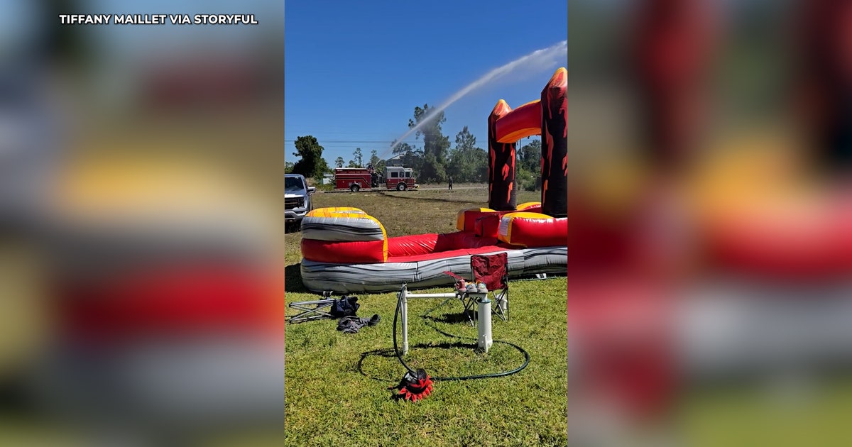 Firefighters make kids' day by hosing down bouncy slide | FOX 13 Tampa Bay