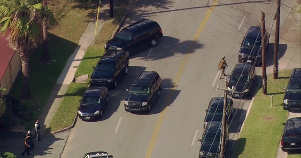 SWAT team takes someone into custody outside southeast Houston motel ...