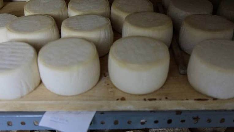 Artist constructing 'cheese wall' next to US-Mexico border 'to make a ...