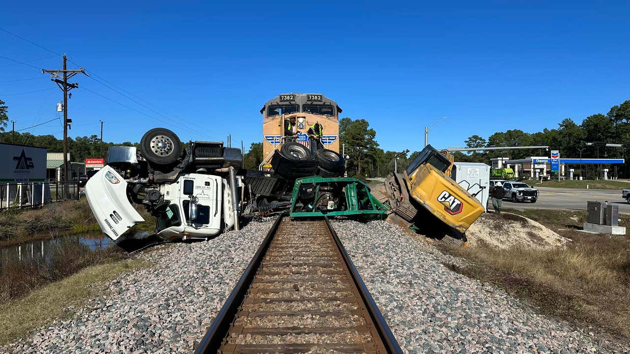 Train, 18-wheeler crash after truck gets stuck on tracks in Waller ...