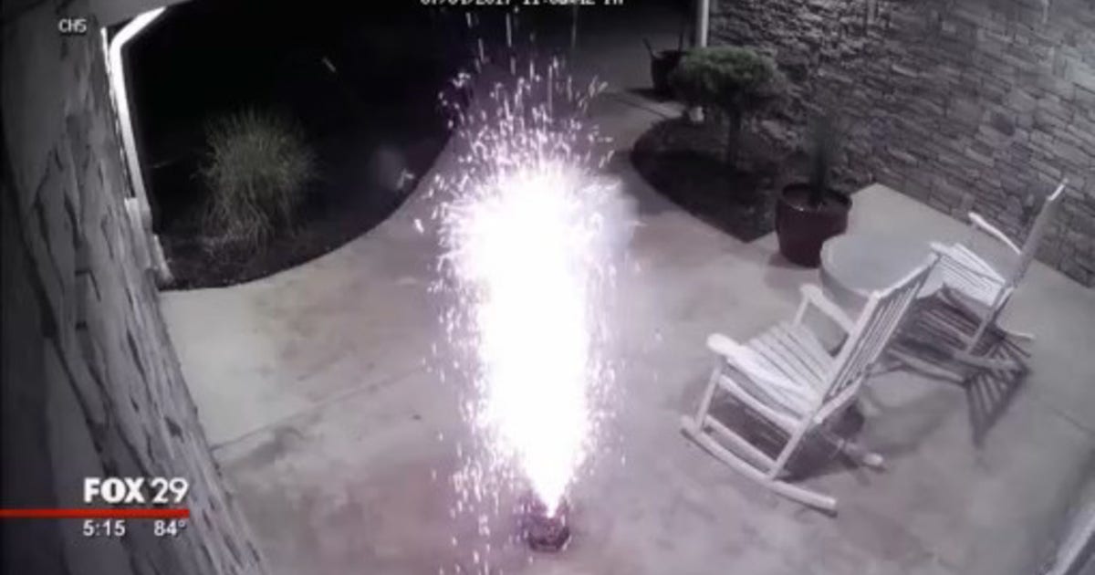 Security camera shows man setting off fireworks on front porch of home ...
