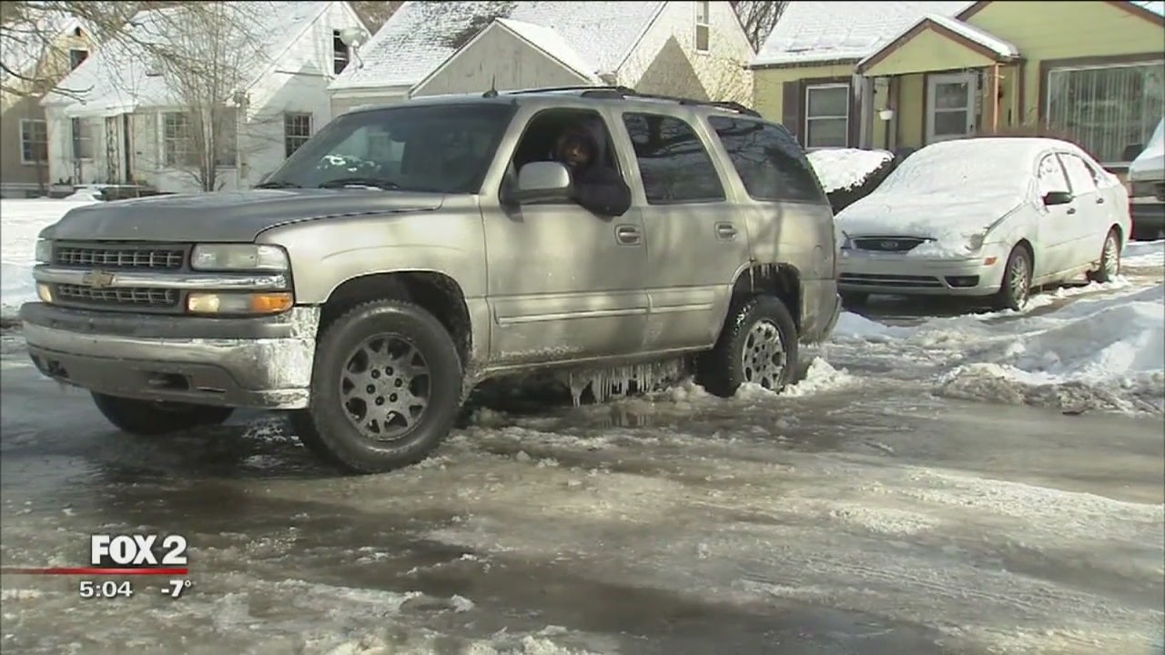 Detroit neighborhood frozen in after water main breaks, floods street ...