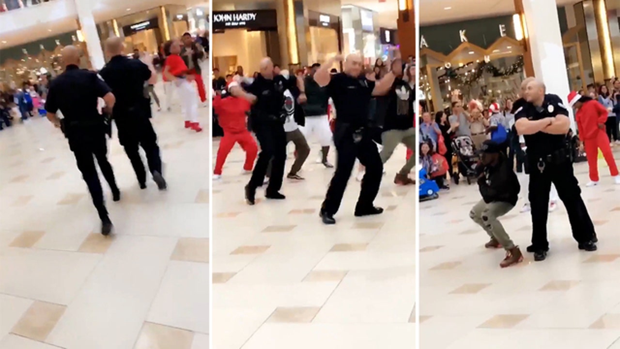 Florida police officers disrupt mall flash mob, then join in on the fun