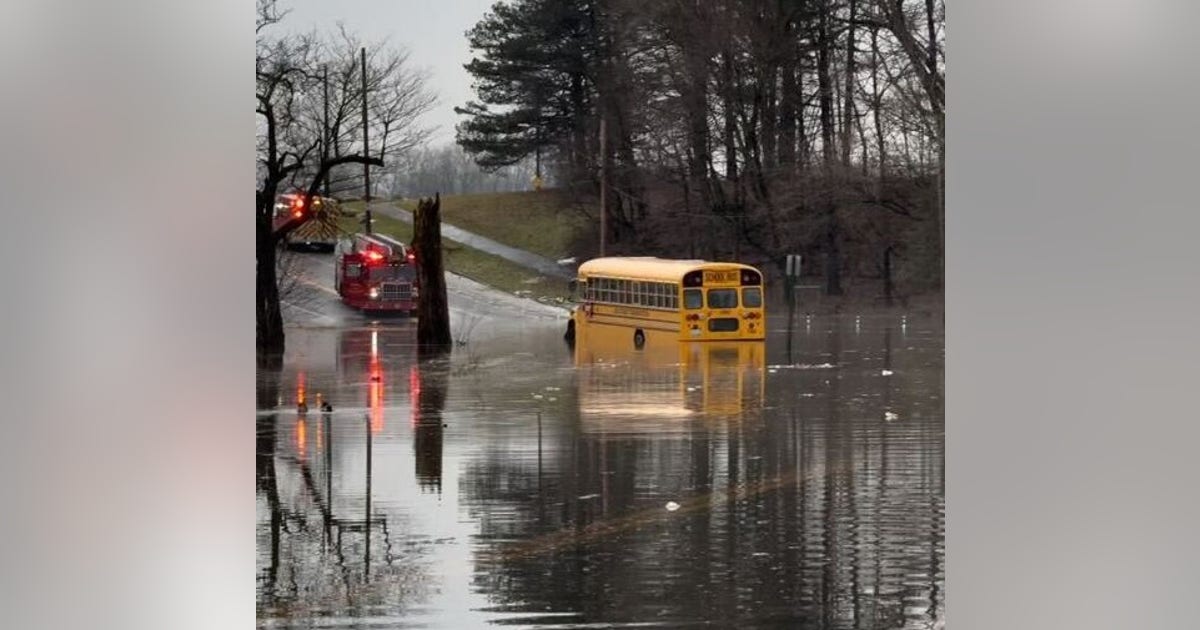 School bus with students inside trapped on flooded road in Detroit ...