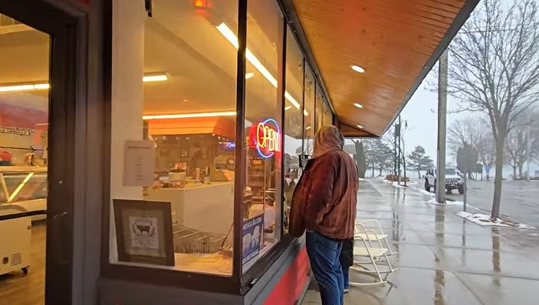 Michigan store owner pepper-sprayed after confrontation with group ...