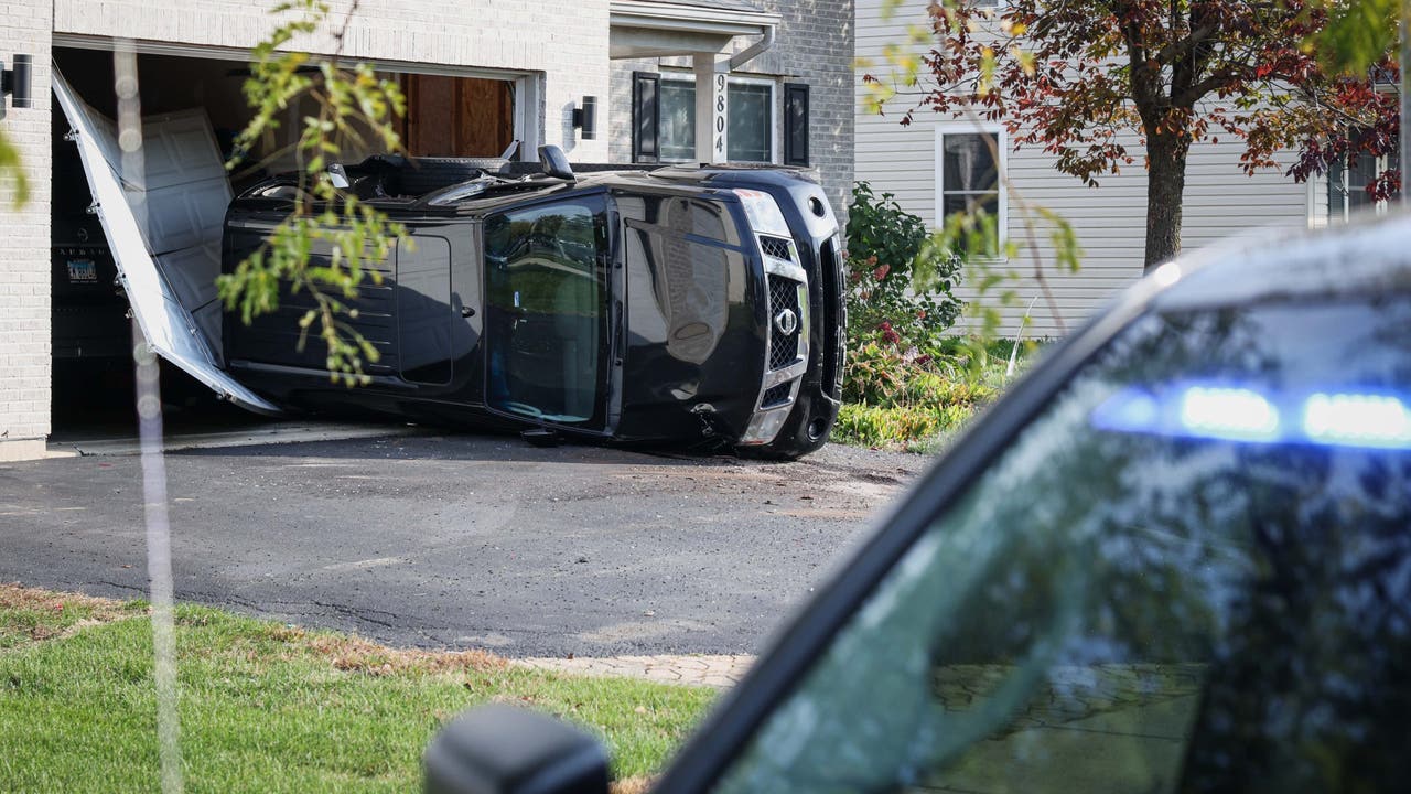 Jeep crash sends parked car flipping into garage: officials | FOX 32 ...
