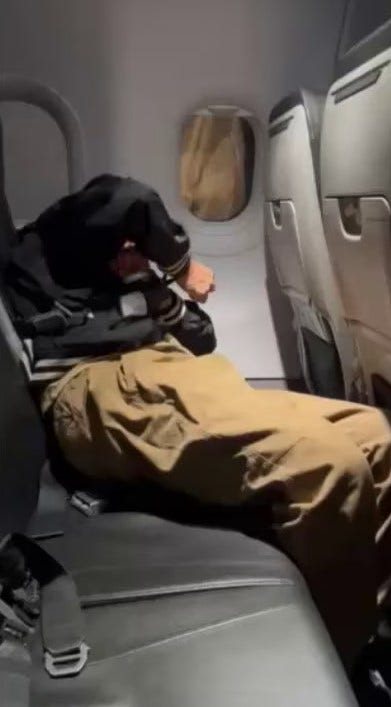 Chicago-bound flyer accused of trying to open plane door, choking ...