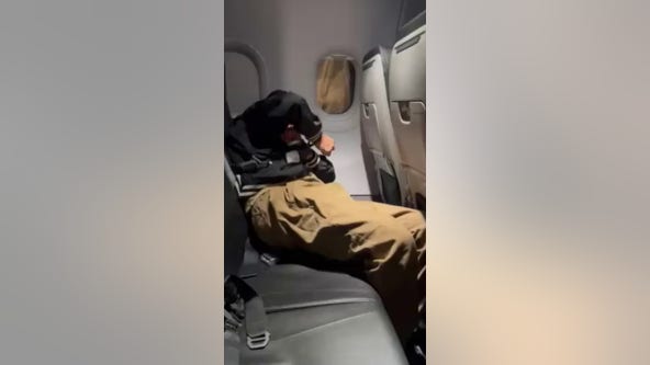 Chicago-bound flyer accused of trying to open plane door, choking ...