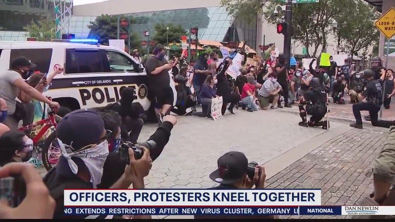 Orlando police officers, protesters kneel together | FOX 35 Orlando