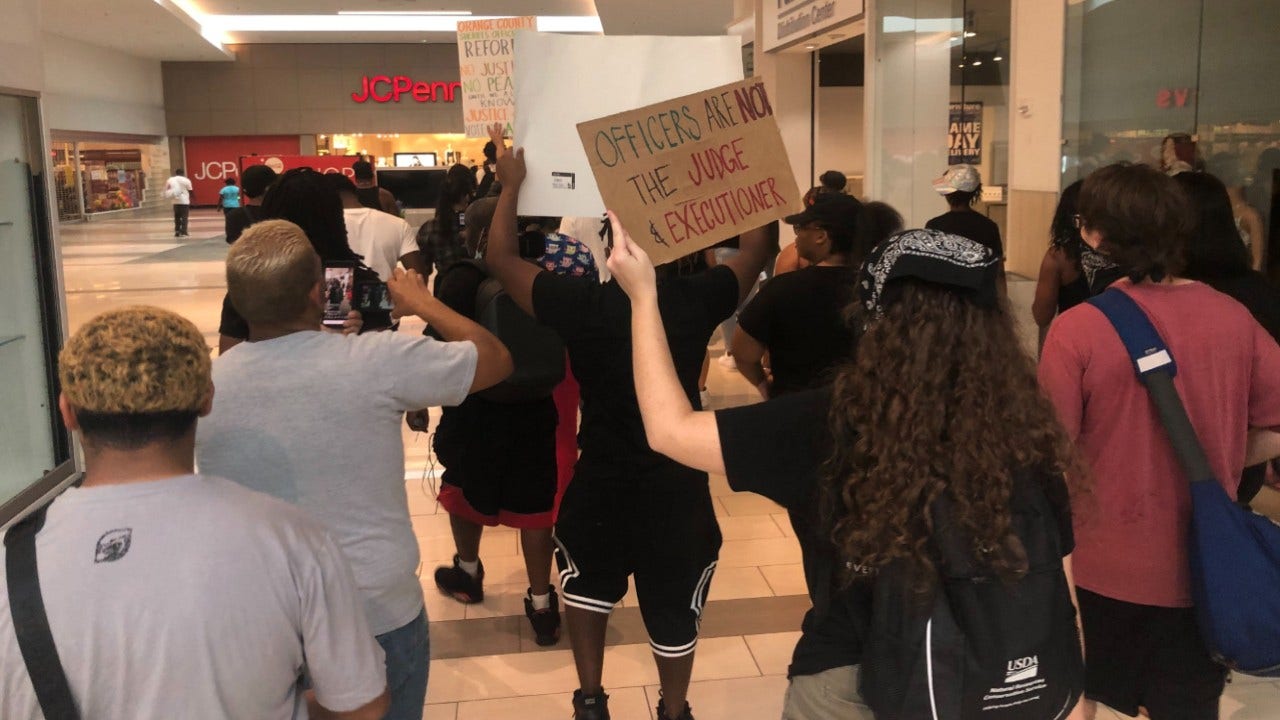 Protesters of deputy-involved shooting march through Florida Mall after ...