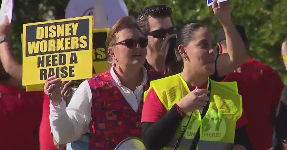 Disney workers rally for a raise in march outside Florida parks | FOX ...