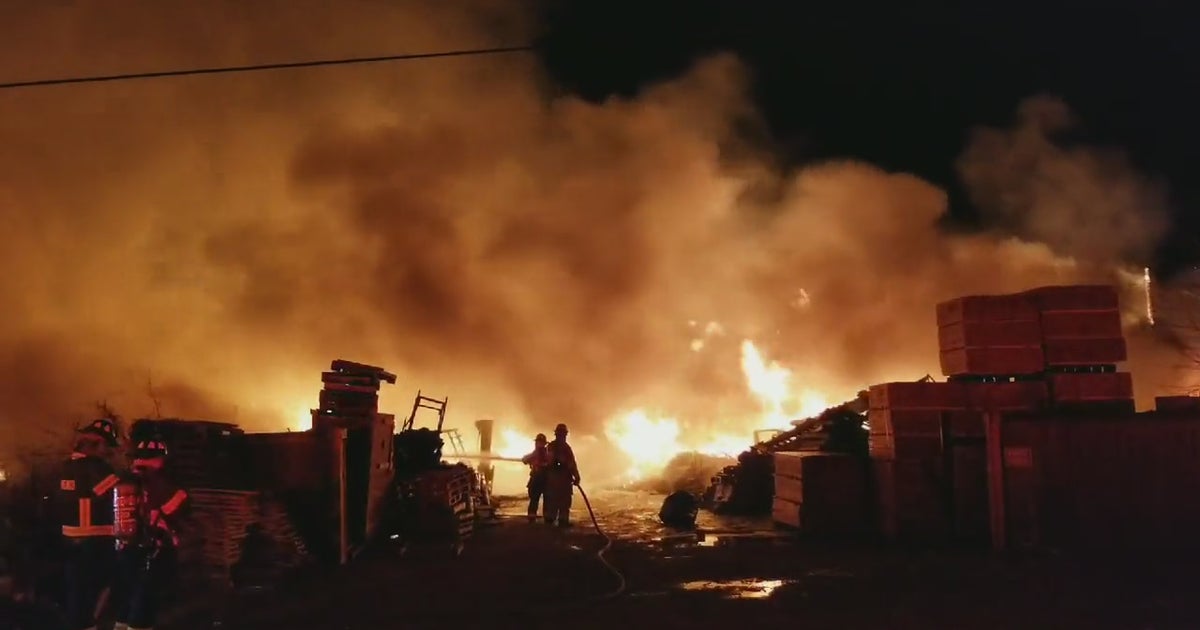 Firefighters battling Johnson County pallet fire take shelter after ...