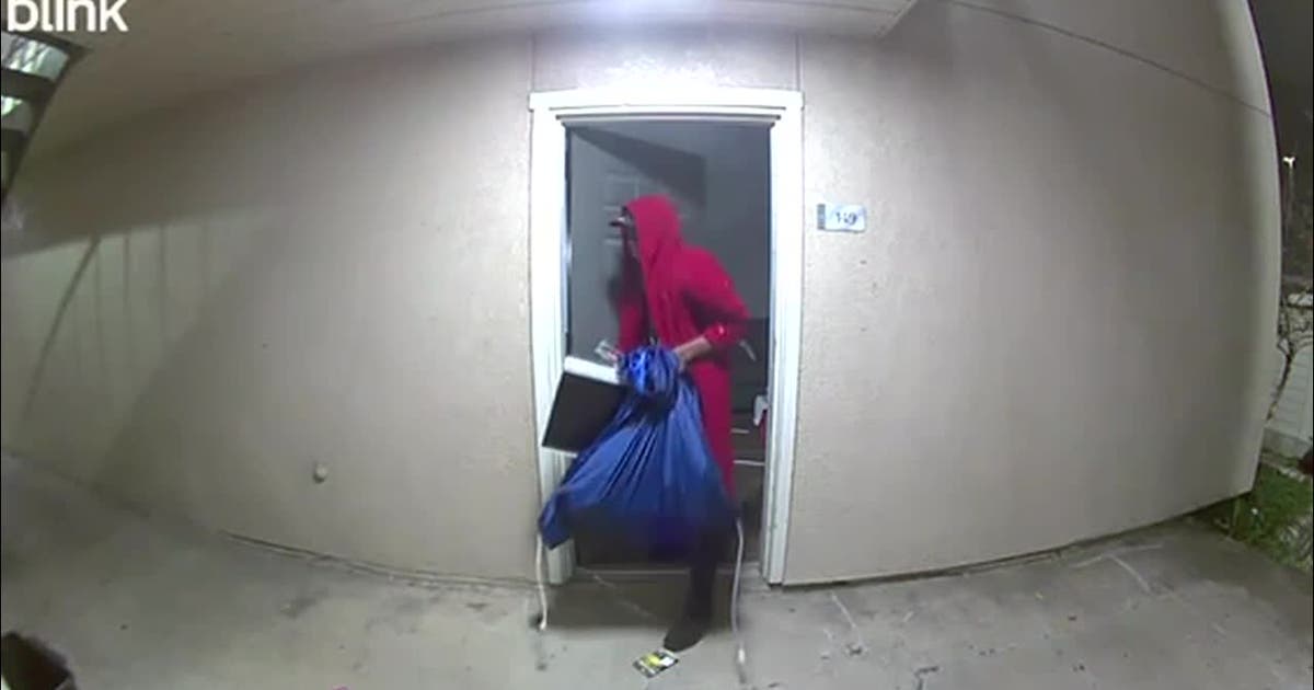 Video shows burglar in red robe stealing all of Dallas man’s belongings ...