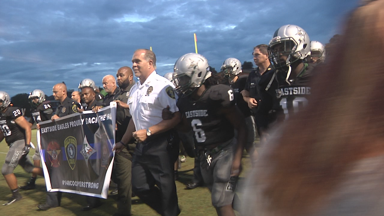 Officer Matt Cooper, law enforcement honored at football game | FOX 5 ...