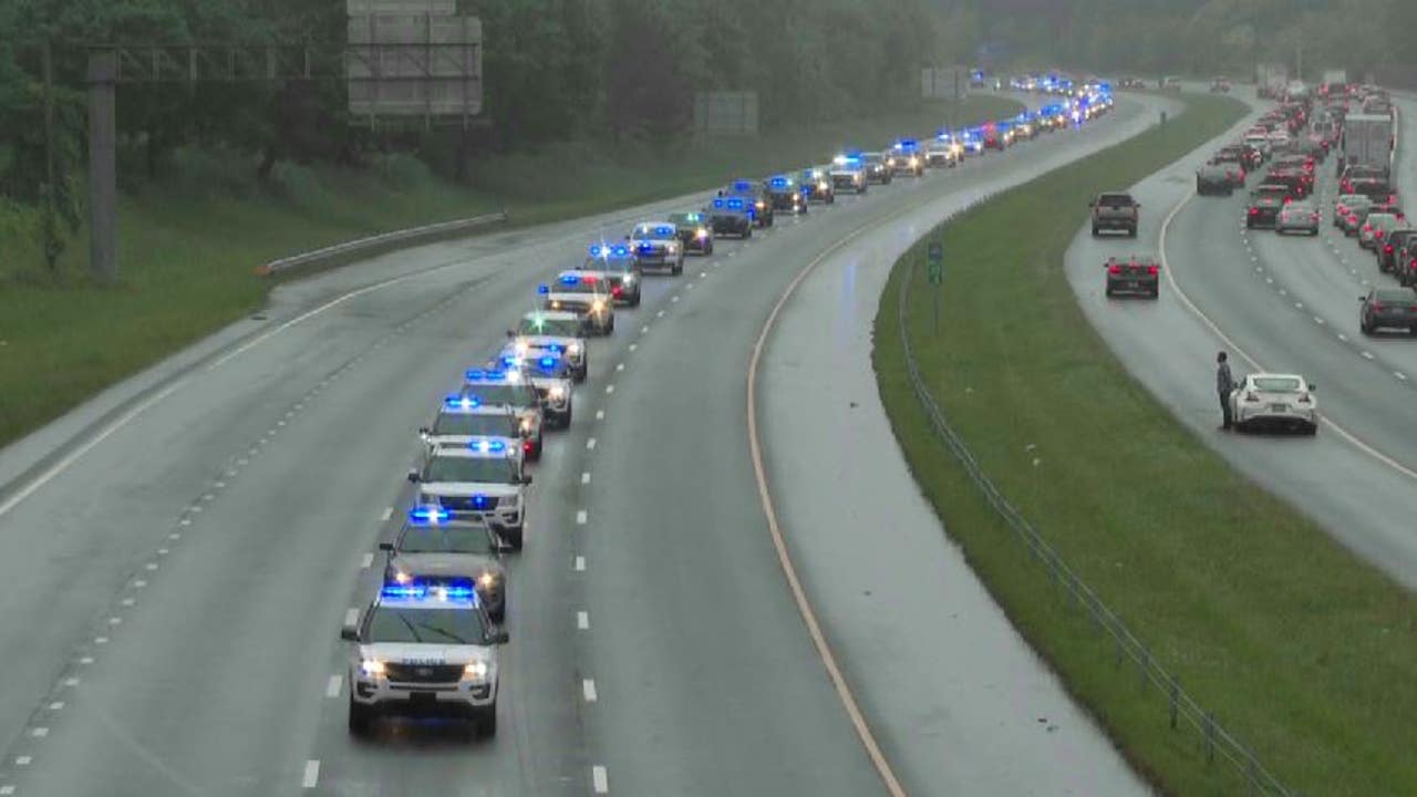 Remembering a hero: Hundreds paid their respects to fallen police ...