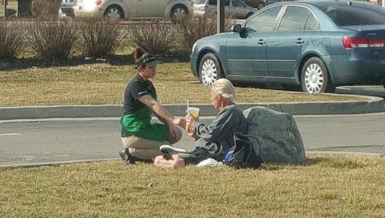 Viral photo: Starbucks barista kneels down, feeds homeless man | FOX 5 ...