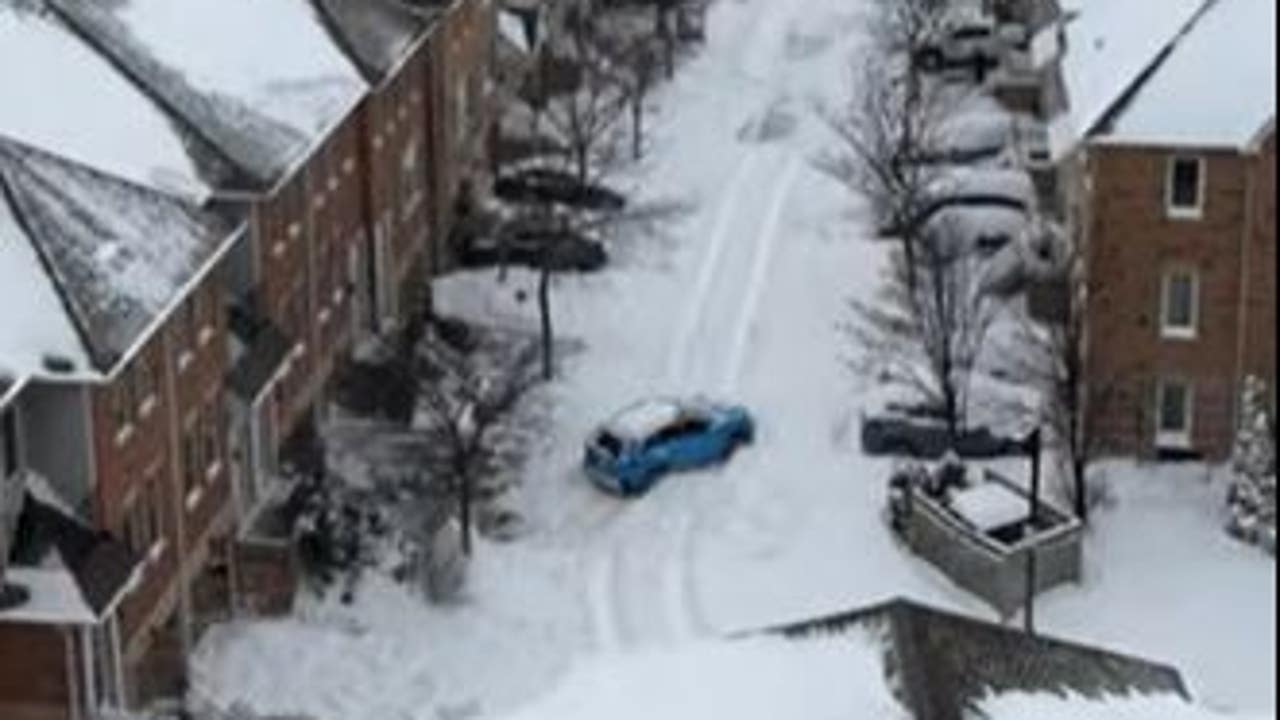 Timelapse video shows motorist struggling to leave street during ...