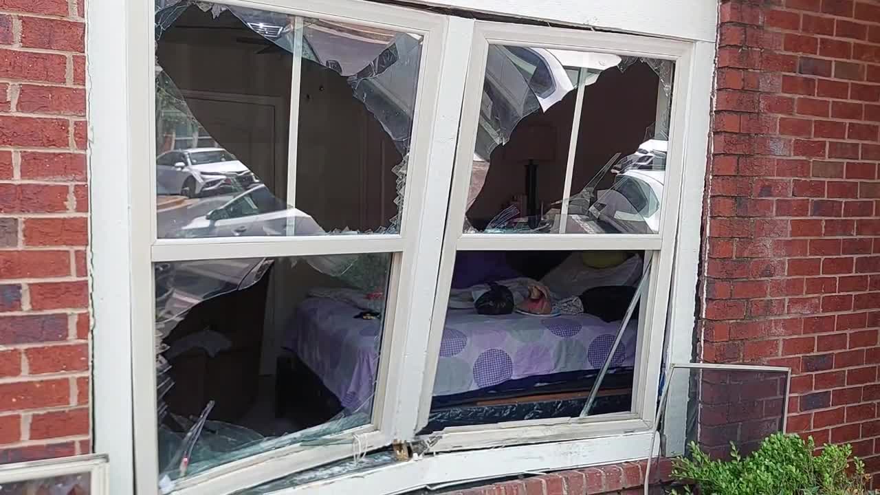 Car crashes through bedroom window just feet from sleeping mother ...