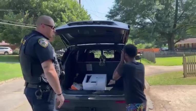 Watch: Georgia police officer surprises boy with PlayStation | FOX 5 ... Watch: Georgia police officer surprises boy with PlayStation | FOX 5 ...