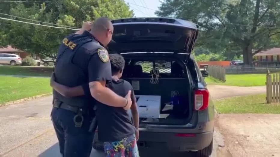 Watch: Georgia police officer surprises boy with PlayStation | FOX 5 ... Watch: Georgia police officer surprises boy with PlayStation | FOX 5 ...
