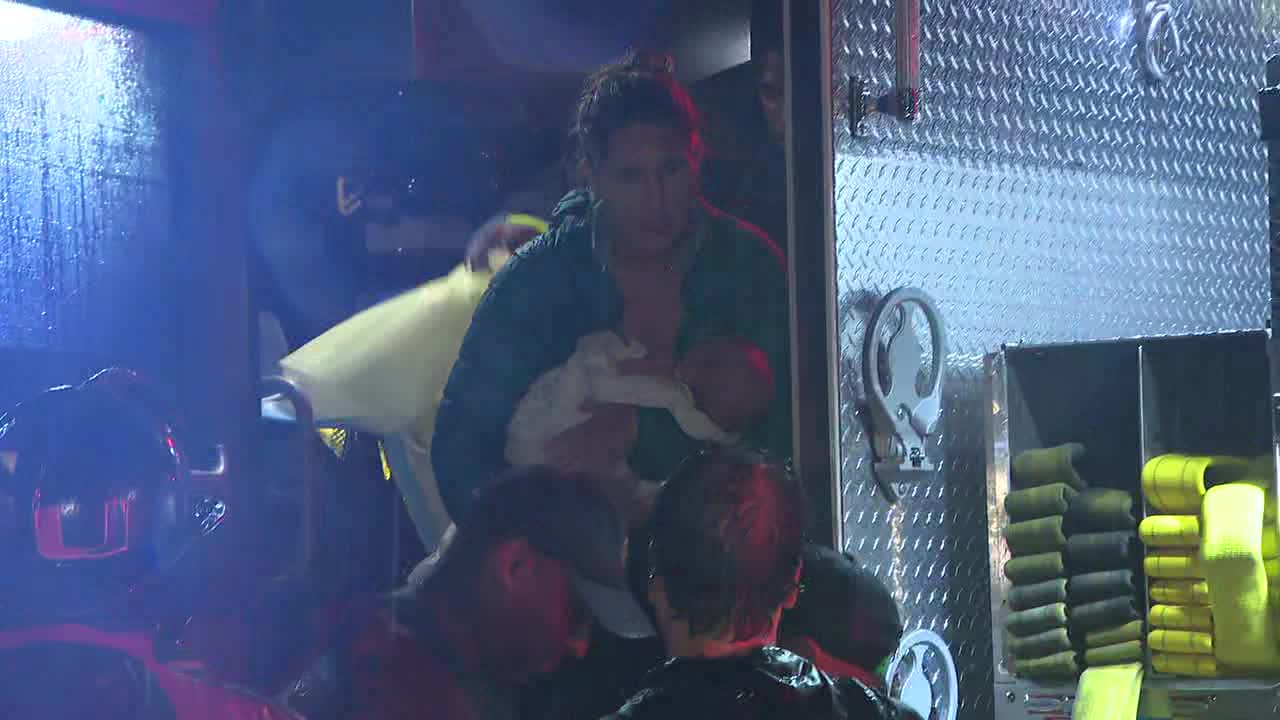 WATCH: Amazing rescue of family with baby and dogs from rising ...