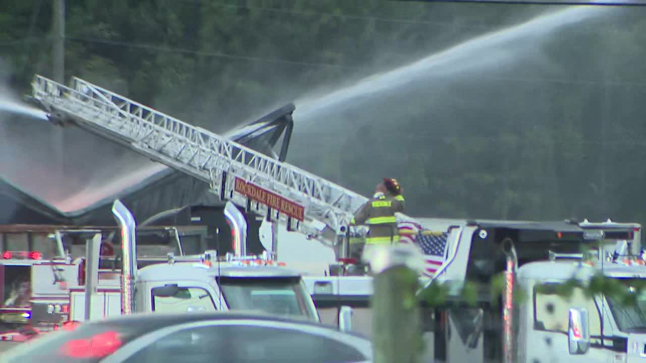 Massive blaze guts auto body shop in Rockdale County, smoke visible for ...