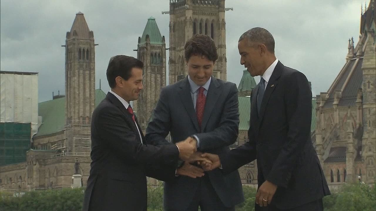 President Obama shares awkward handshake with leaders from Mexico, Canada