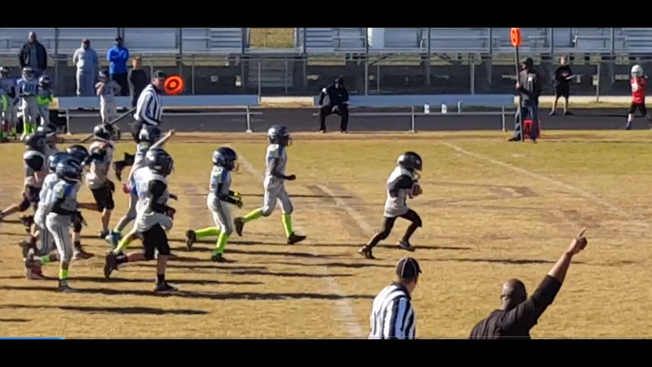 Youth football team helps special needs student score touchdown
